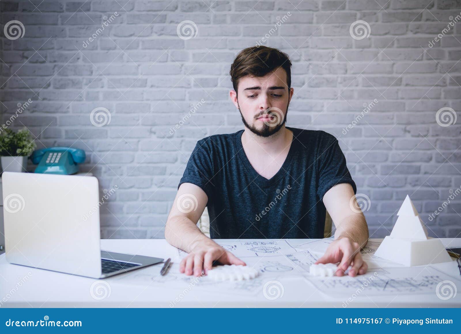 Engineering Man Working on Blueprint for Designing Mechanical Pa Stock ...