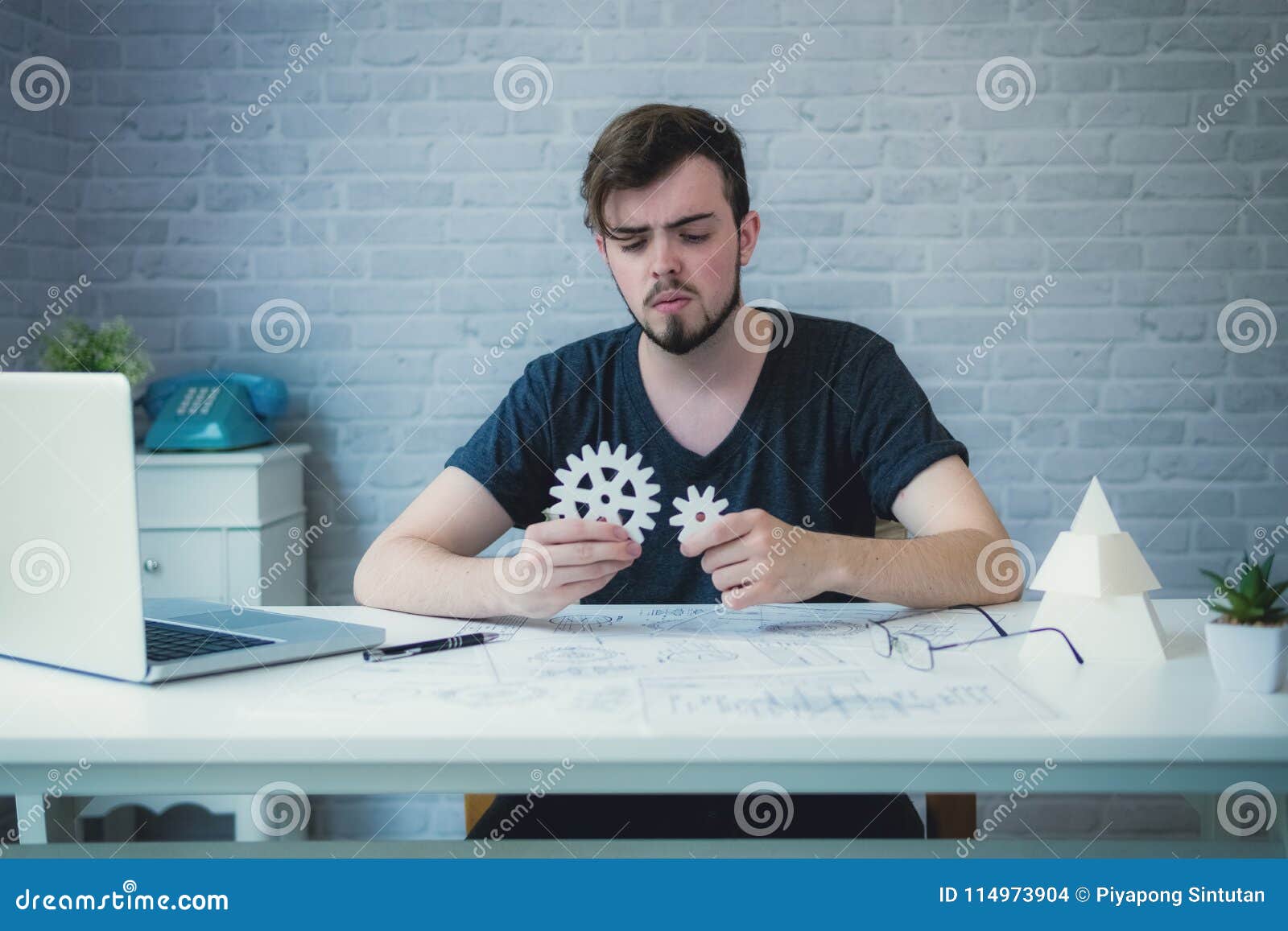 Engineering Man Working on Blueprint for Designing Mechanical Pa Stock ...