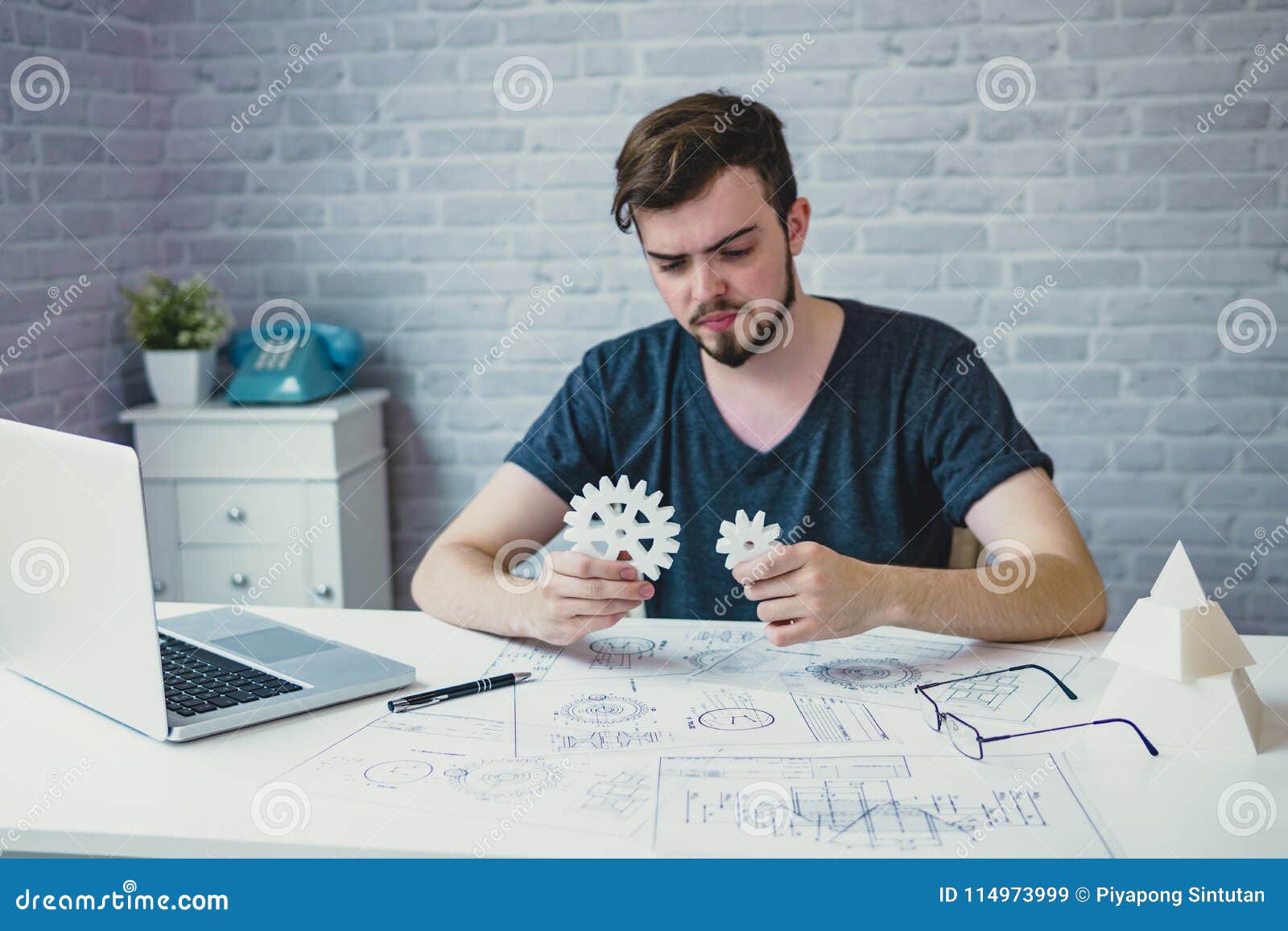Engineering Man Working on Blueprint for Designing Mechanical Pa Stock ...