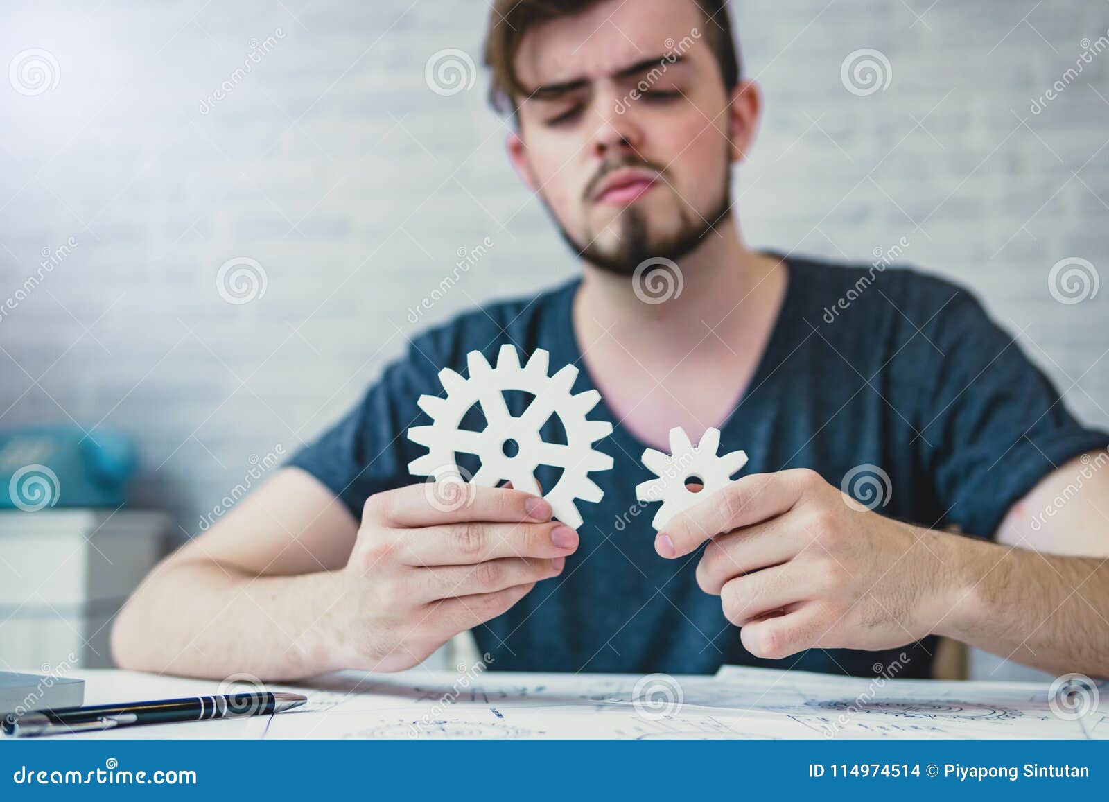 Engineering Man Working on Blueprint for Designing Mechanical Pa Stock ...