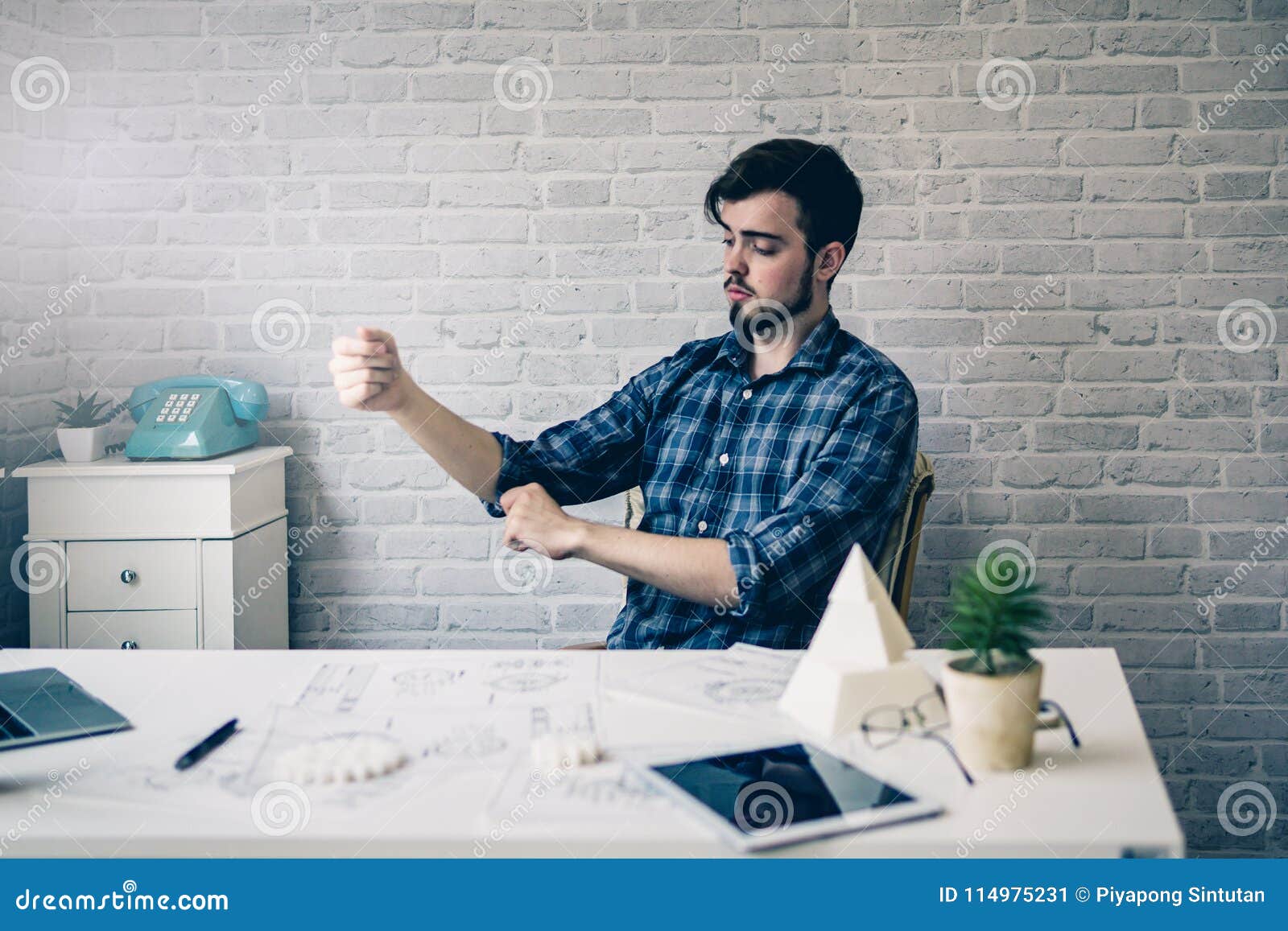 Engineering Man Working a New Project on Blueprint for Designing Stock ...