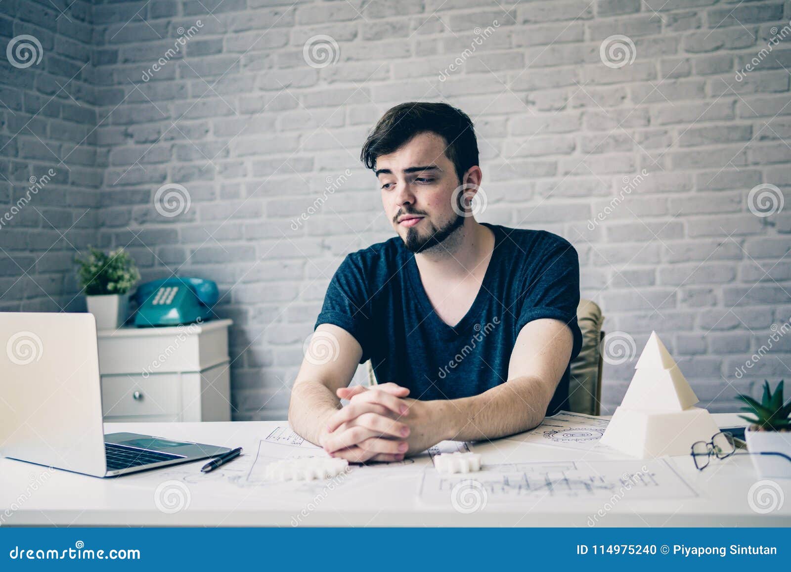 Engineering Man Working a New Project on Blueprint for Designing Stock ...