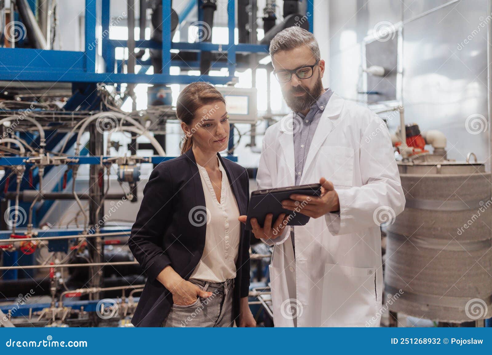 Engineering Managers with Tablet Doing Routine Check Up in Industrial ...