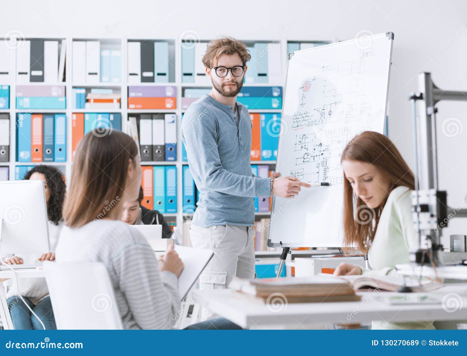 Engineering Students Discussing Ideas Together Stock Image - Image of ...