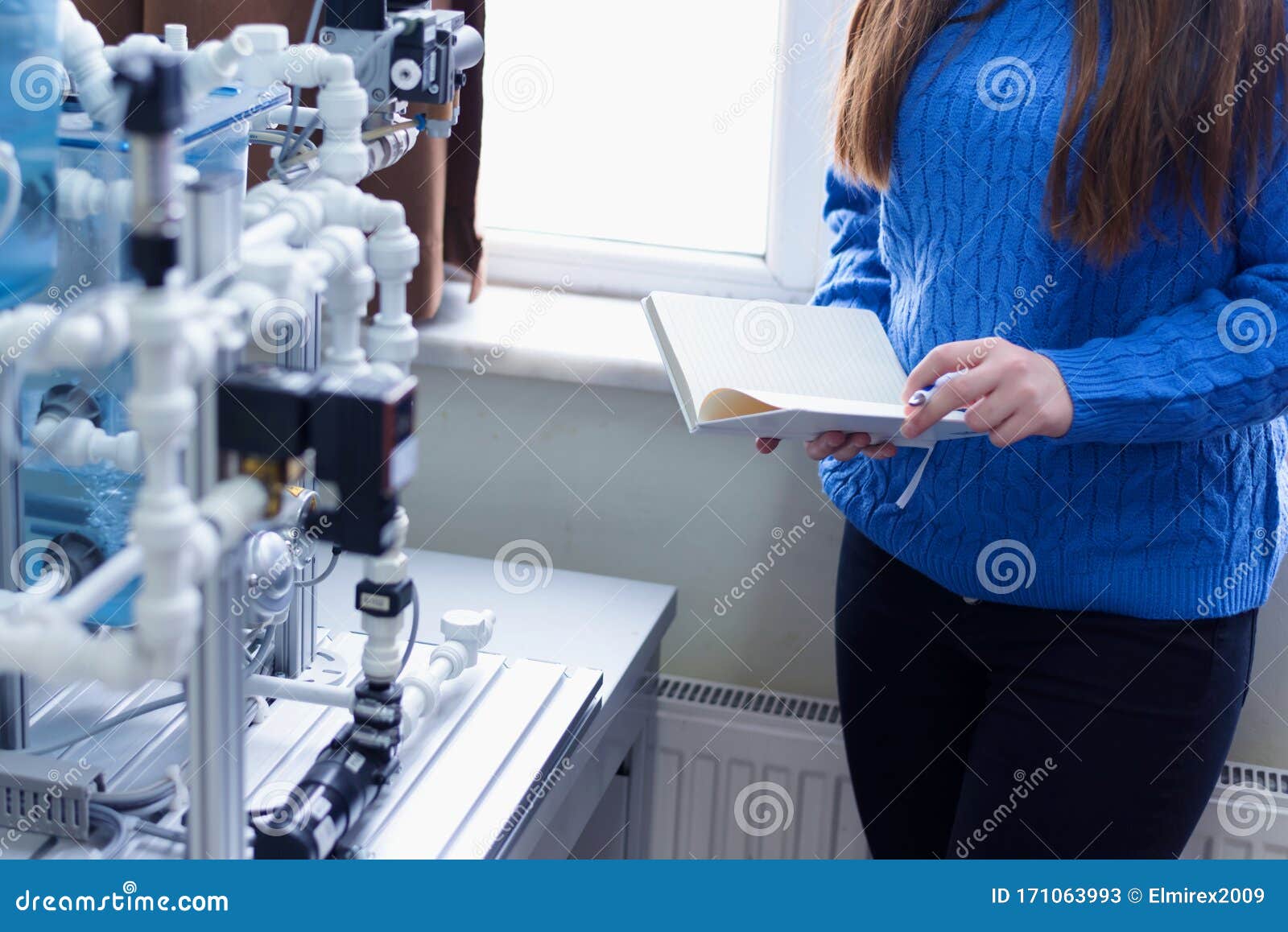 Engineering Students Working in the Lab. Students are Adjusting an ...