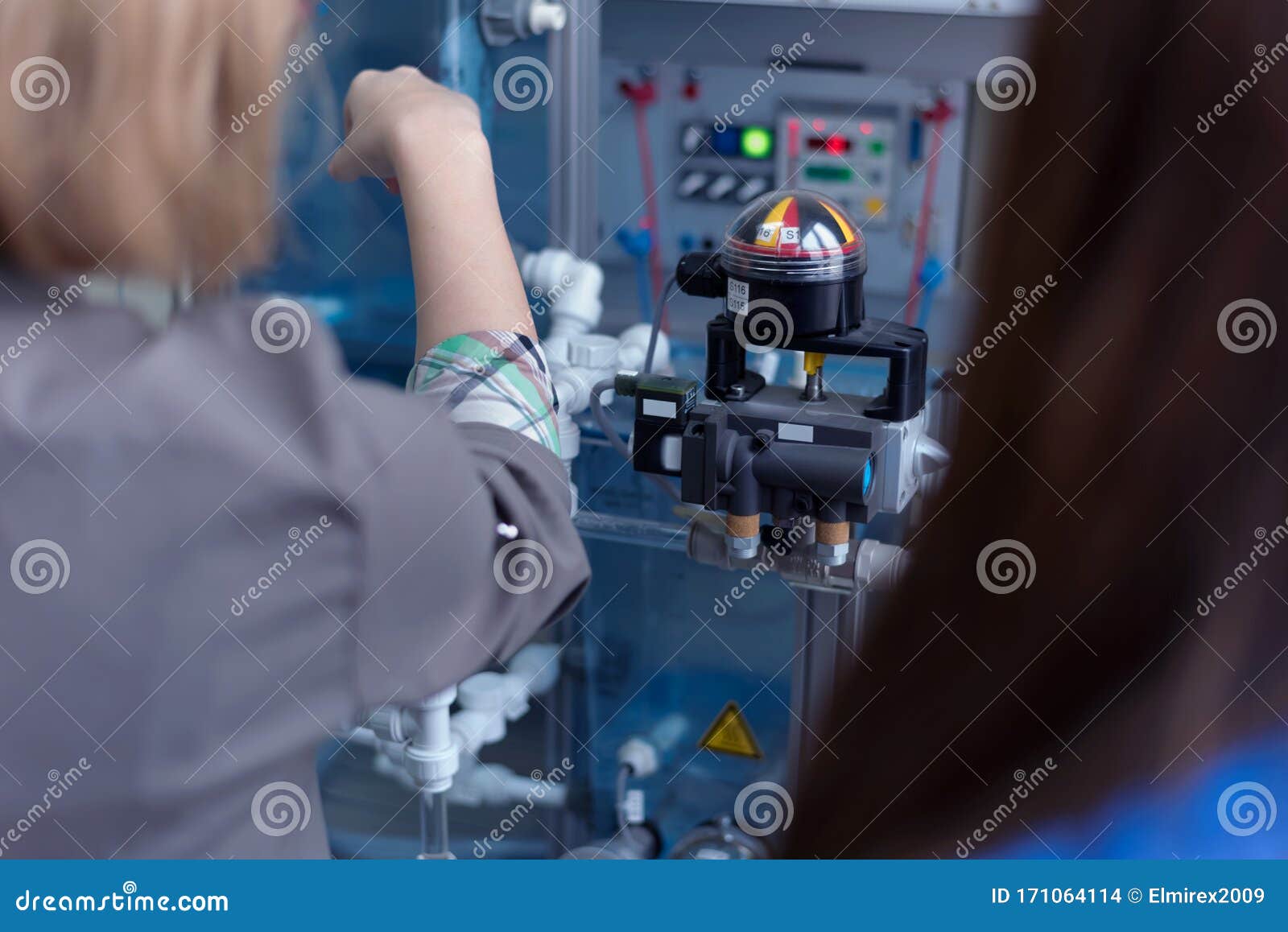 Engineering Students Working in the Lab. Students are Adjusting an ...