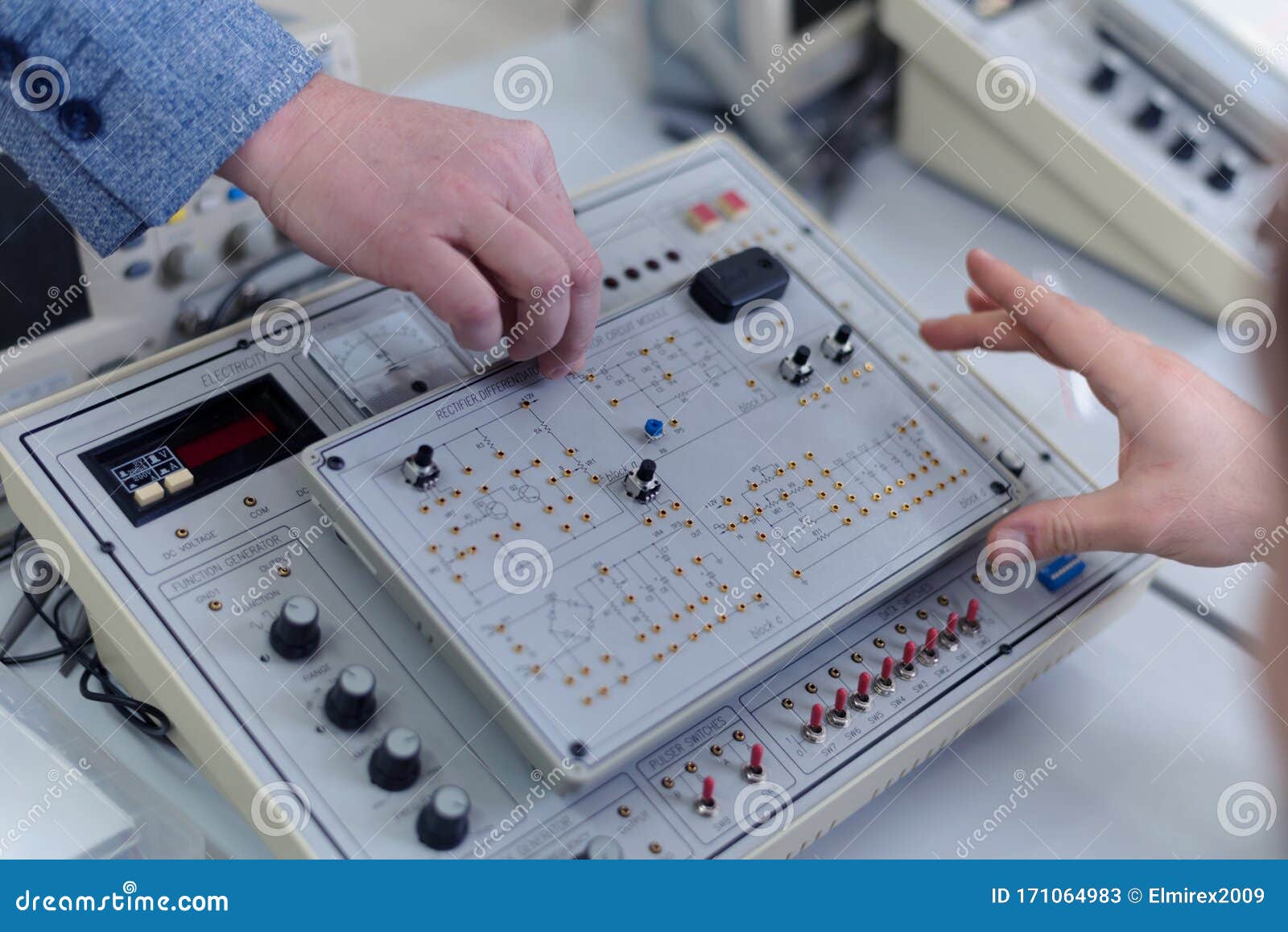 Engineering Students Working in the Lab. Students are Adjusting an ...