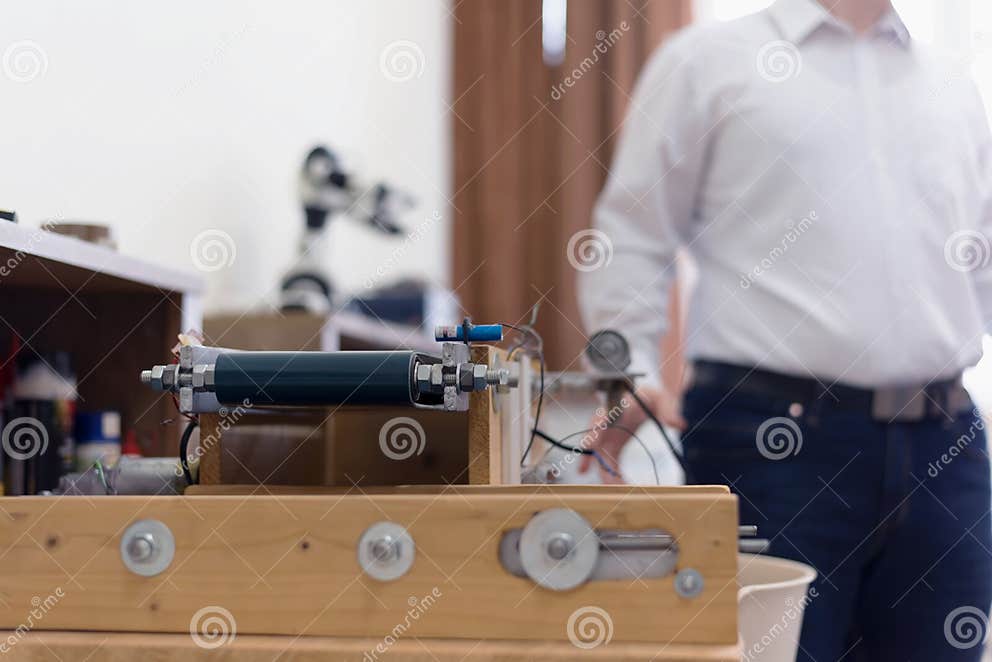 Engineering Students Working in the Lab. Students are Adjusting an ...