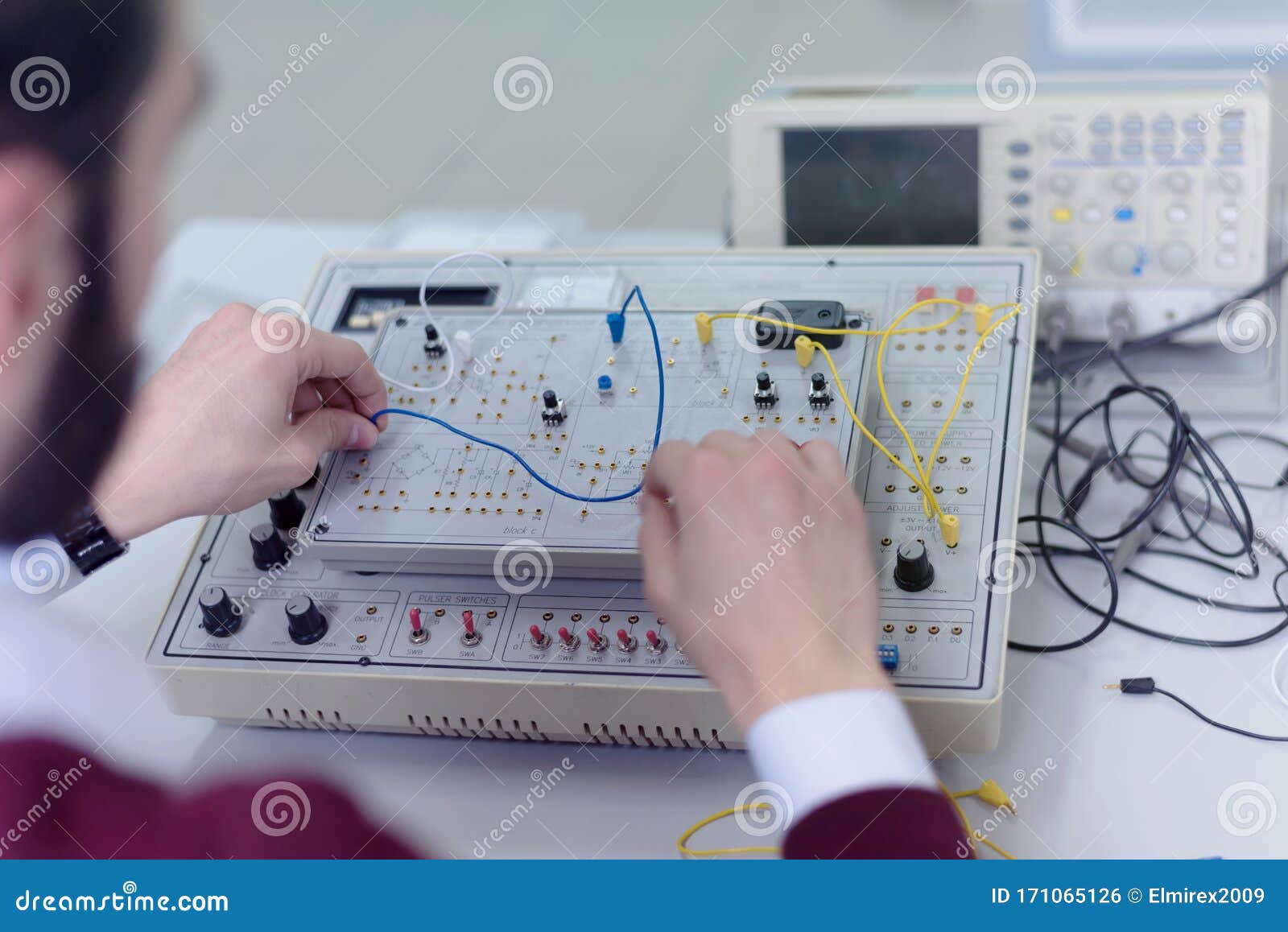 Engineering Students Working in the Lab. Students are Adjusting an ...