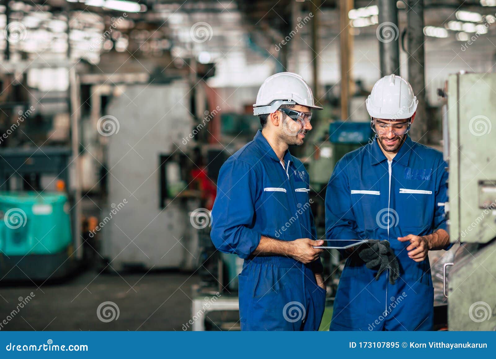 Engineering Team in Heavy Industry Factory Working Together with Space ...