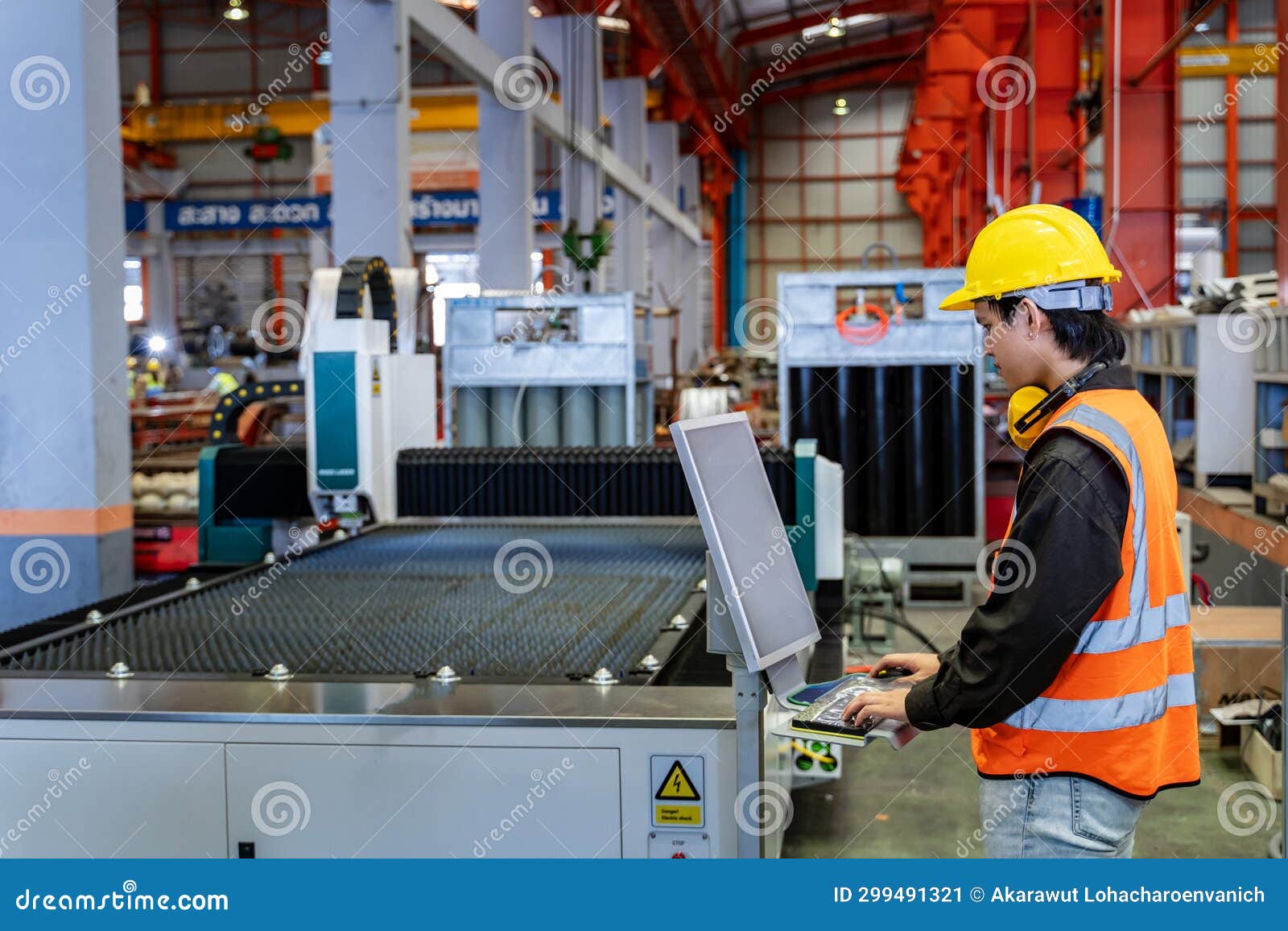 Engineering Technician Worker is Operating the Machine Inside Factory ...