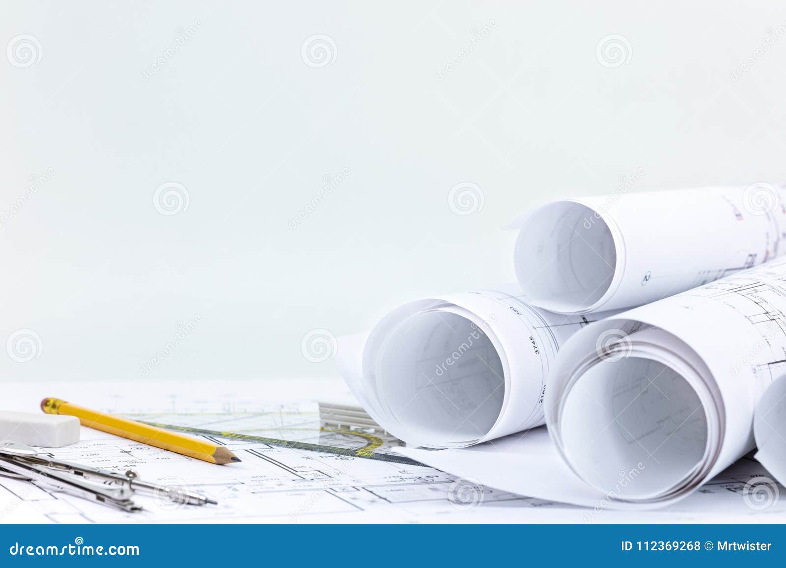 Roll Blueprints and Architectural Project Plans on Wooden Desk Stock ...