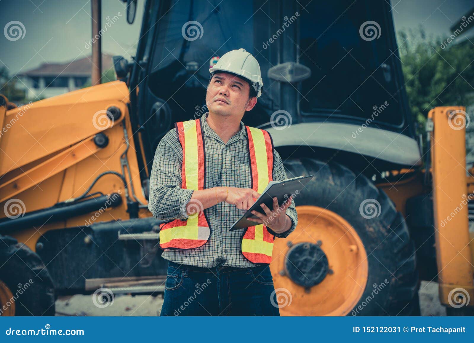 Engineering Wearing a White Safety Helmet Standing in Front of the ...