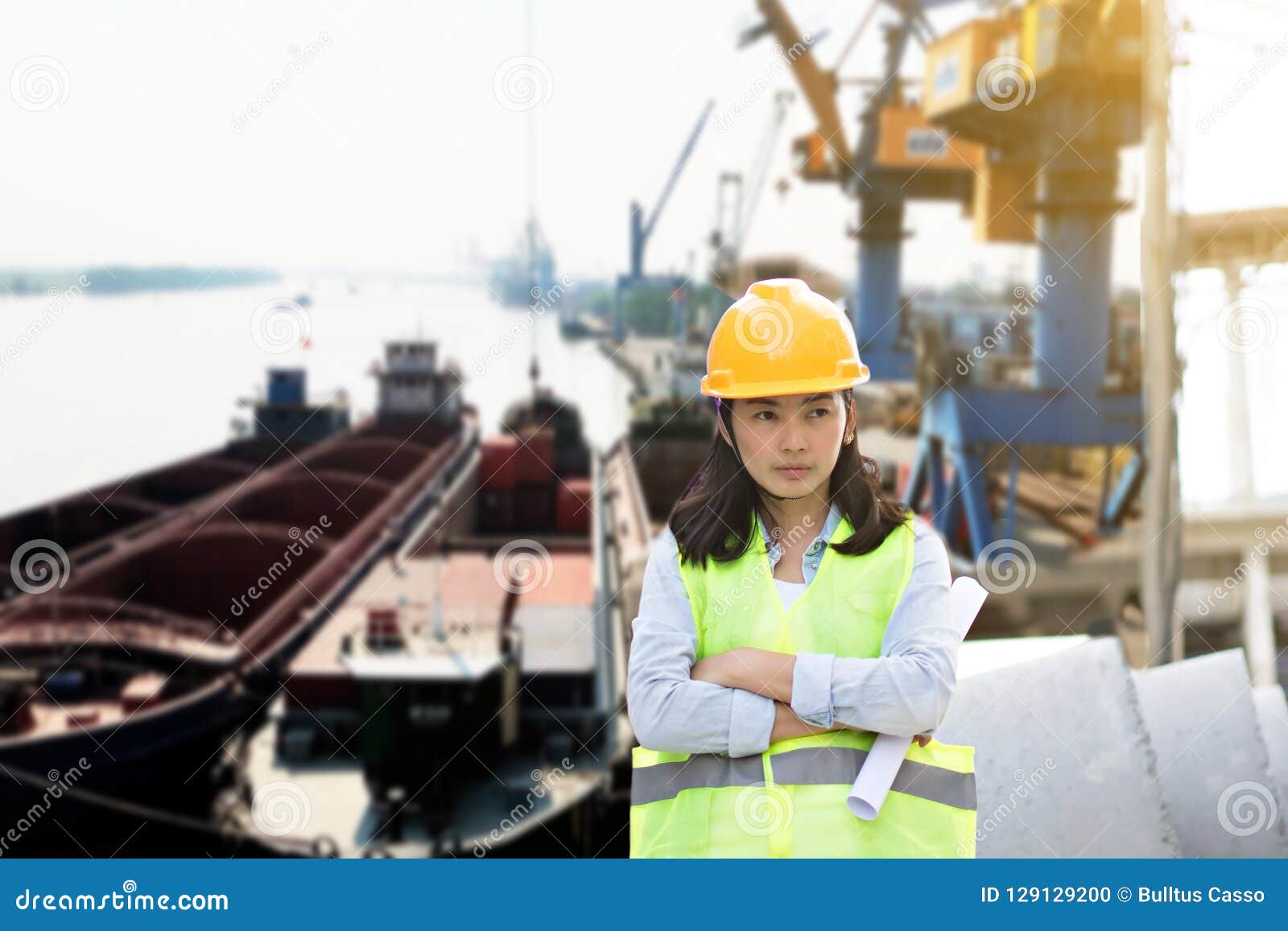 Engineering Wearing Yellow Helmet and Working at Construction Stock ...