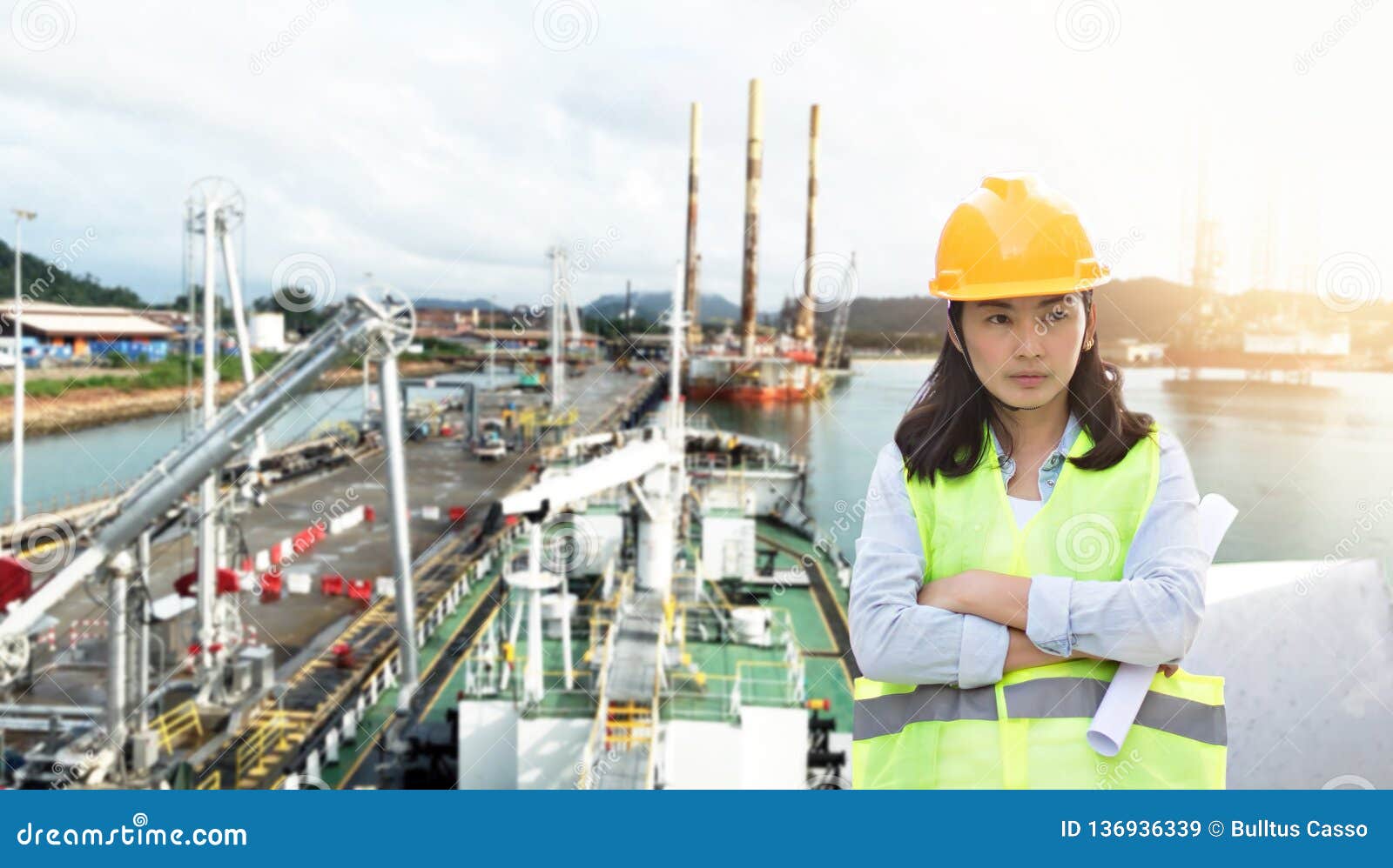 Engineering Wearing Yellow Helmet and Working at Construction Site ...