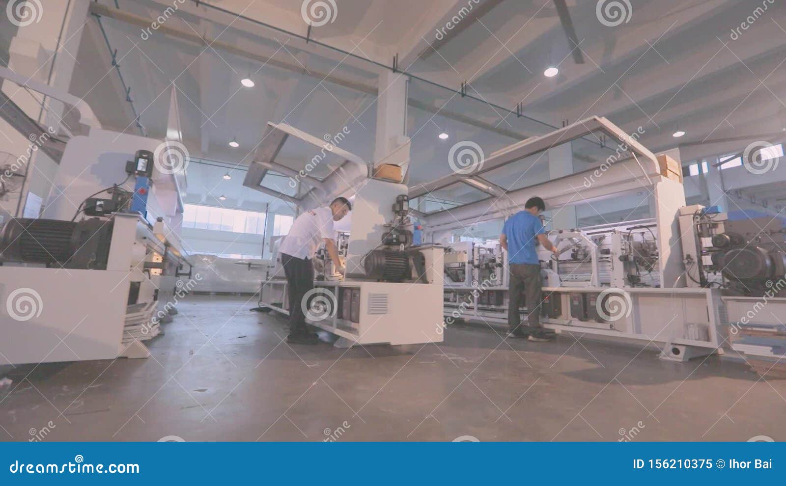 Engineers Assemble Machines at a Large Modern Plant, the Process of ...