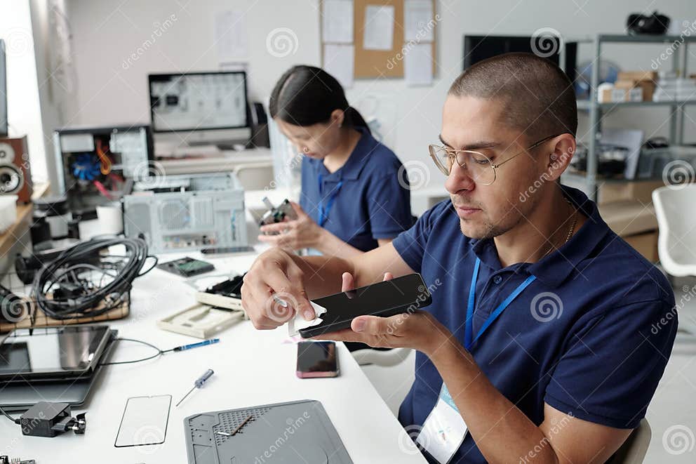 Engineers Assembling Electronic Device Inside Office Setting Stock ...
