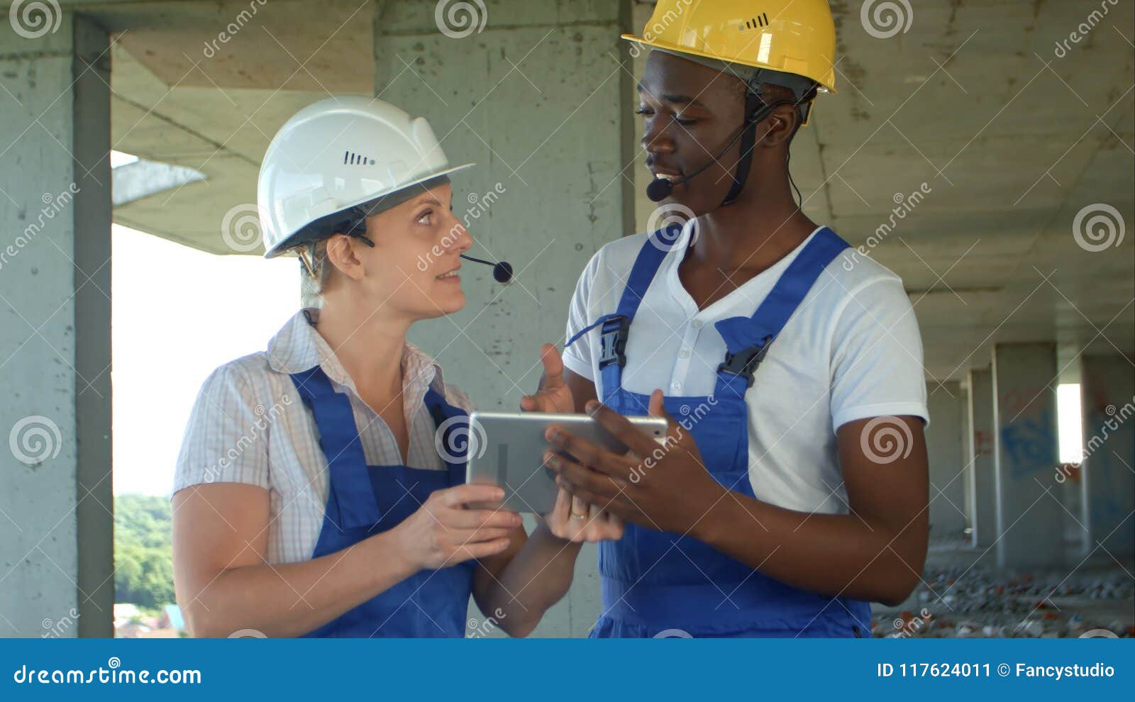 Engineers on Building Site Using Digital Tablet and Talking Stock Image ...