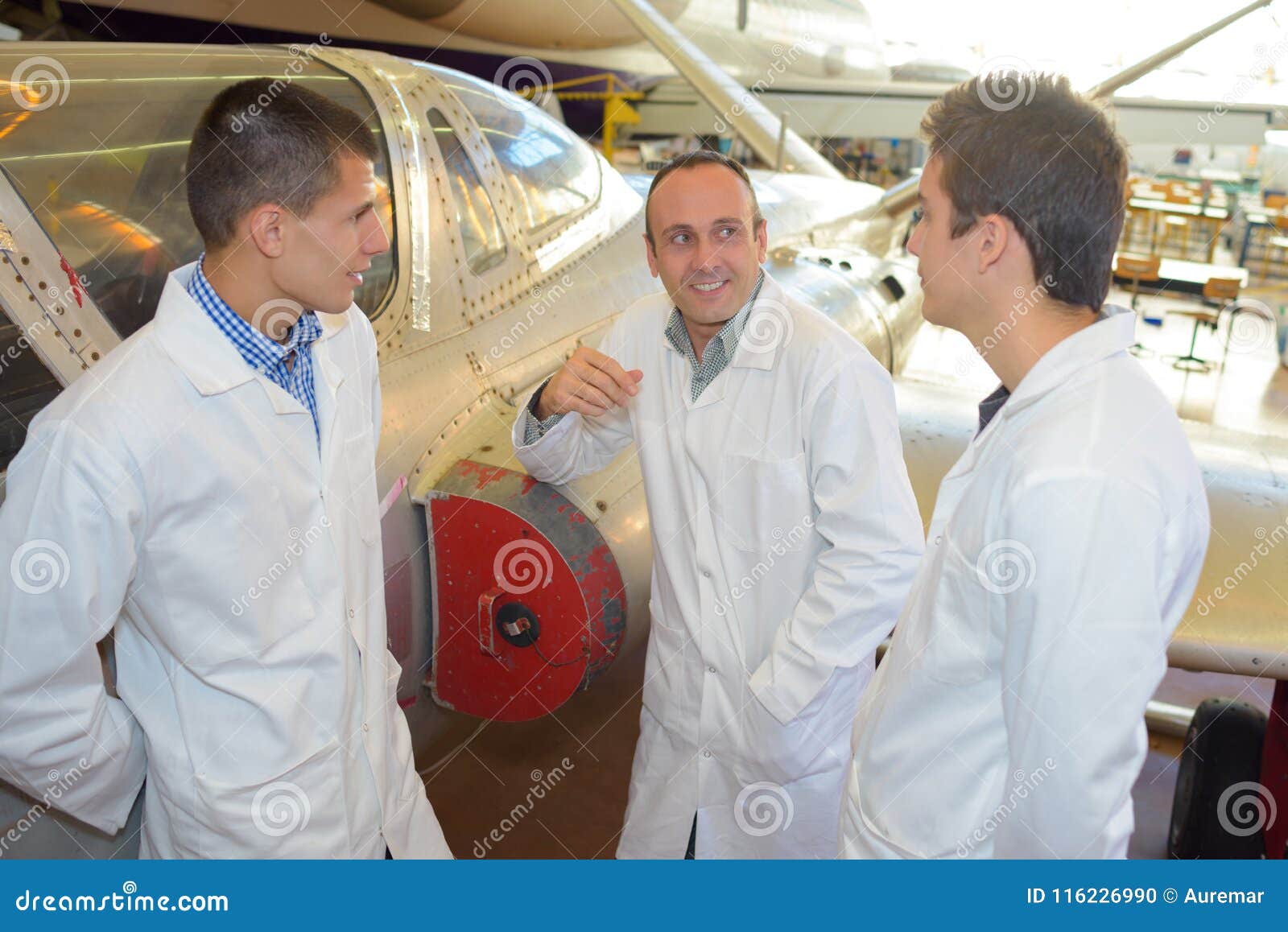 Engineers Chatting Next To Aircraft Stock Photo - Image of aircraft ...