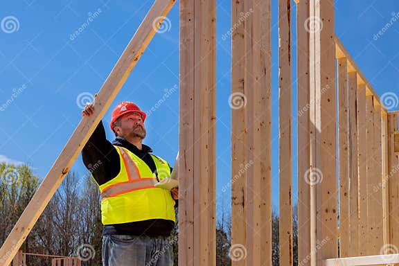 Engineers Checking the Leveling Quality of Wooden Beams Using a Level ...