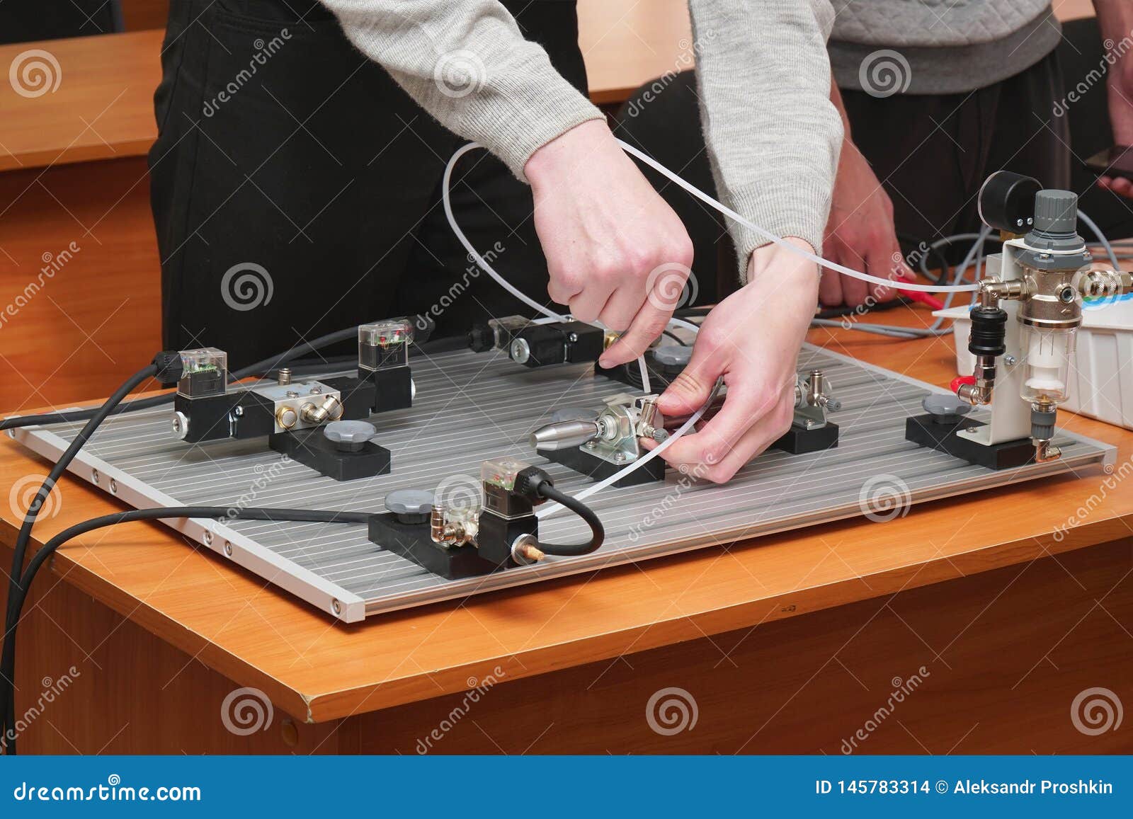 Engineers Connect Wires Control Panel with Small Test Bench for ...