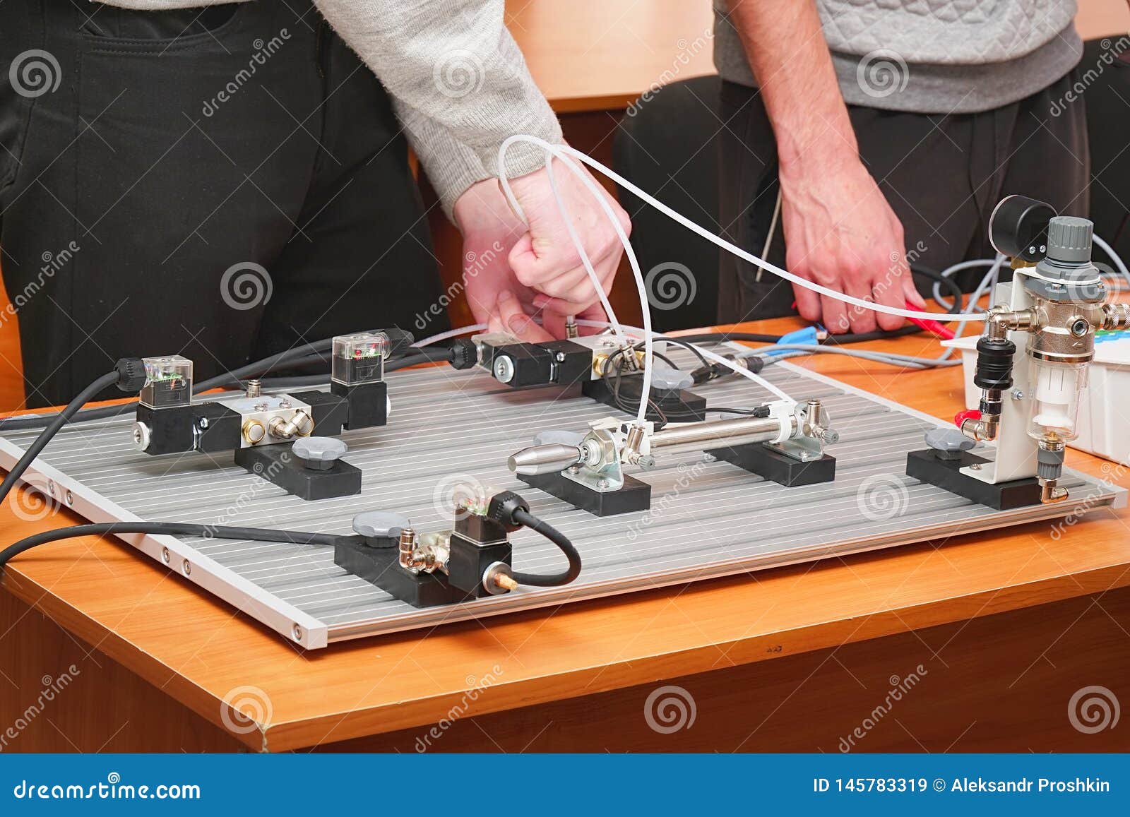 Engineers Connect Wires Control Panel with Small Test Bench for ...