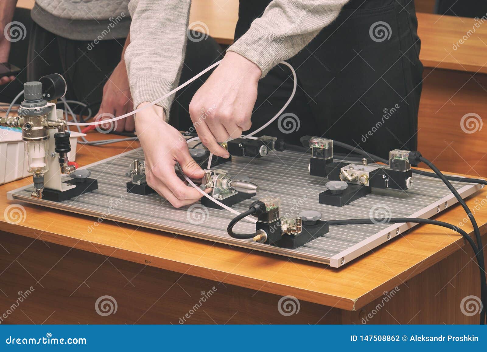 Engineers Connect Wires Control Panel with Small Test Bench for ...