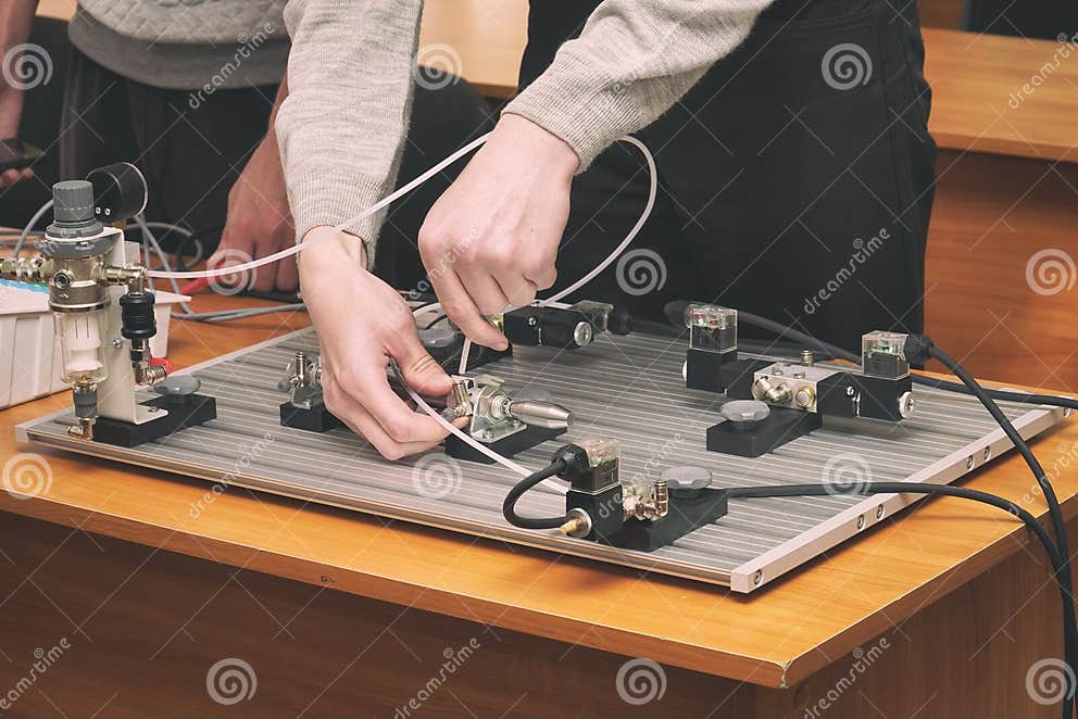 Engineers Connect Wires Control Panel with Small Test Bench for ...