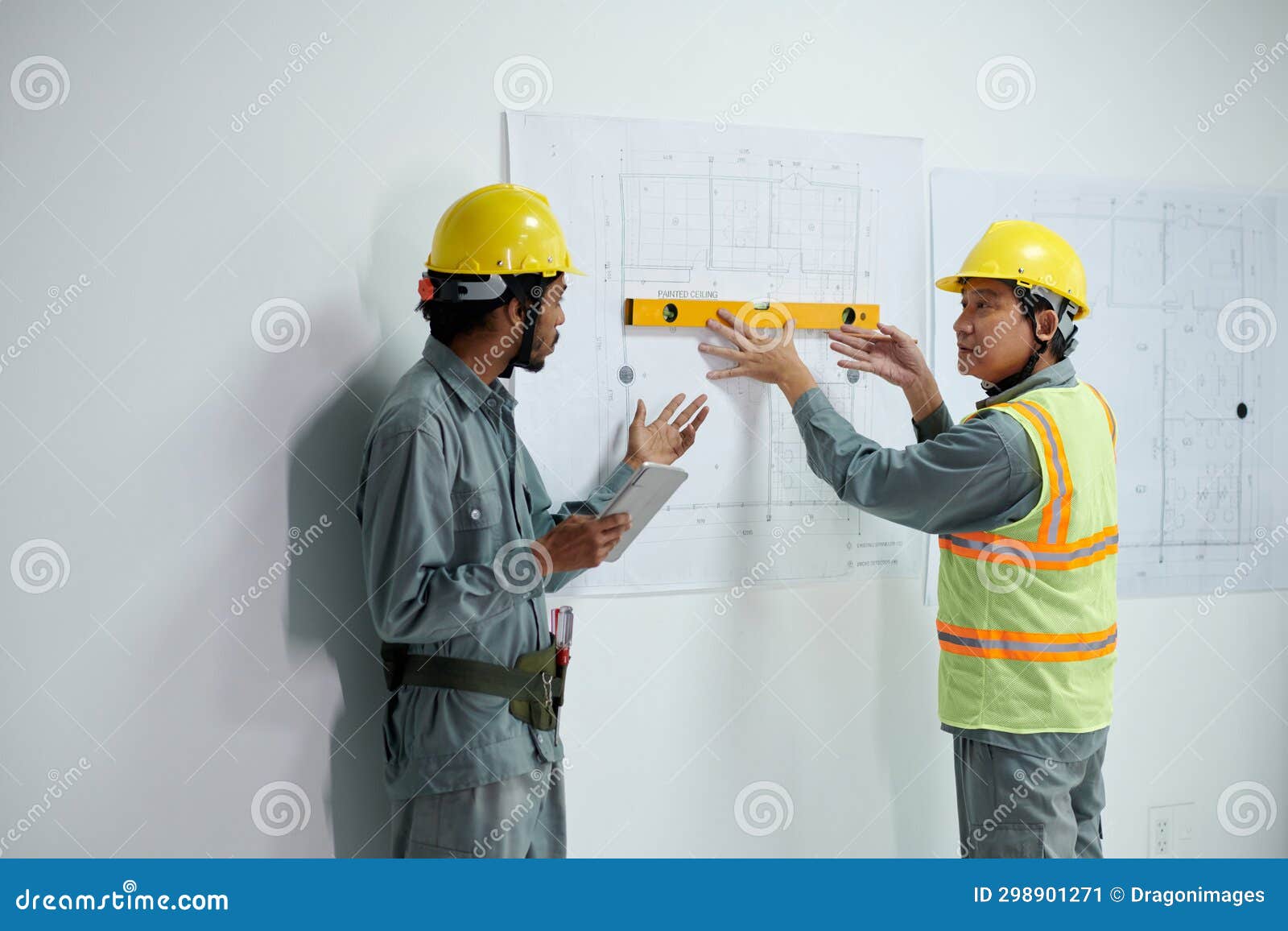 Engineers Discussing Building Blueprint Stock Image - Image of site ...