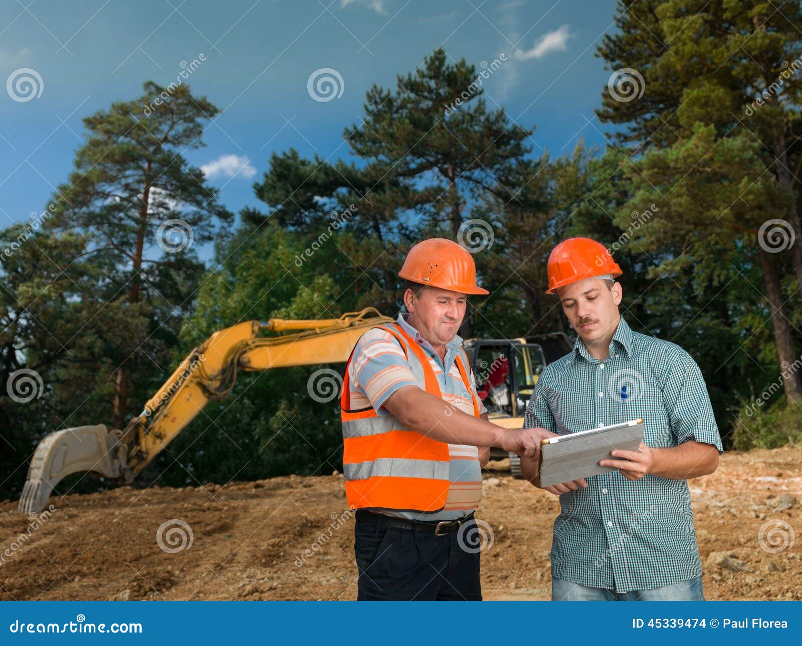 Engineers Discussing on Construction Site Stock Photo - Image of ...