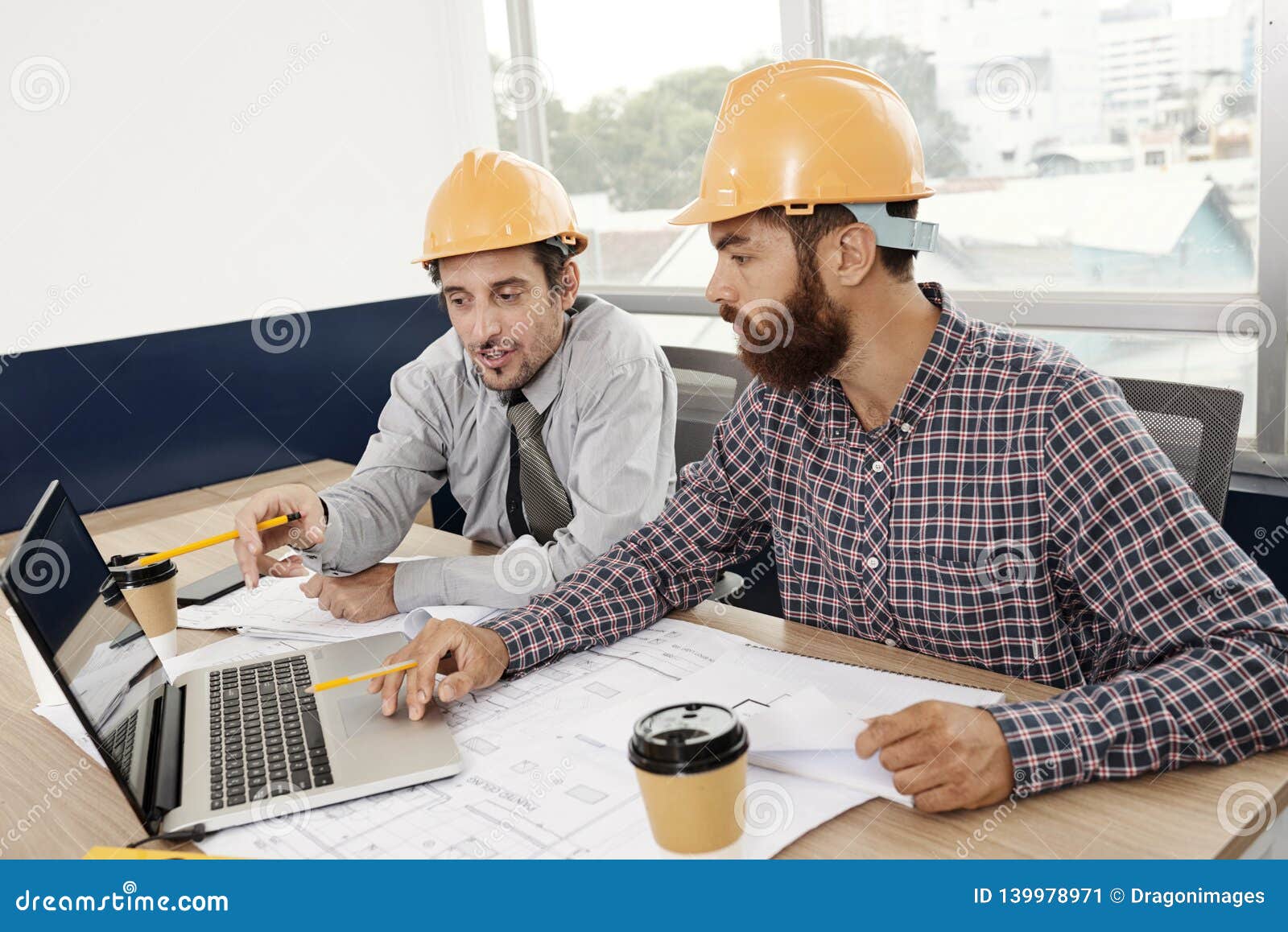 Engineers Discussing Project in Laptop Screen Stock Image - Image of ...