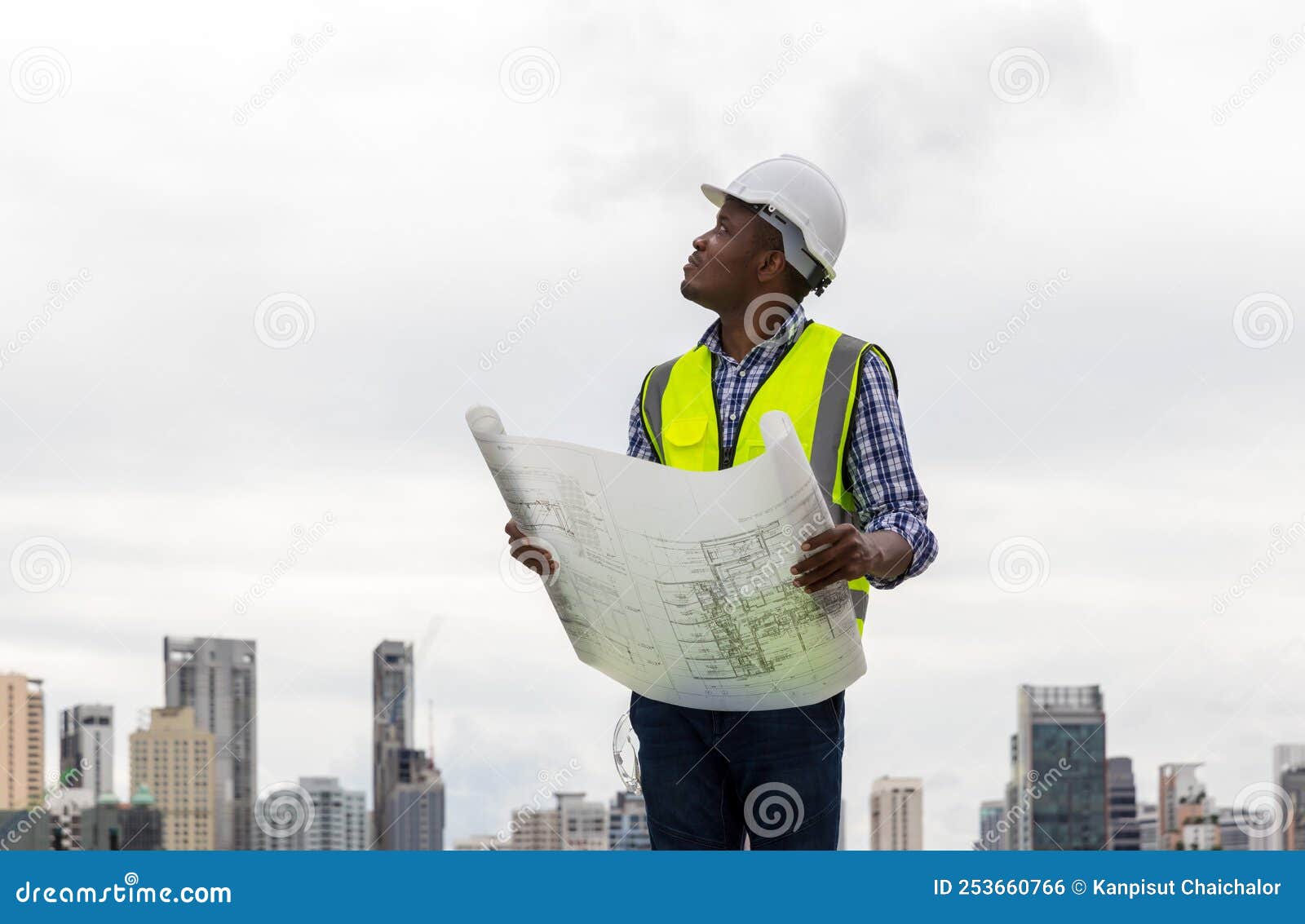 Engineers with Draft Plan of Building on Constructing Site. Engineer ...