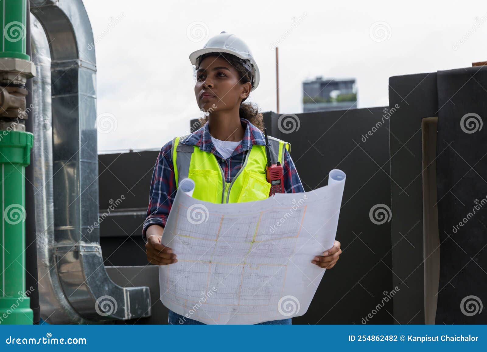 Engineers with Draft Plan of Building on Constructing Site. Engineer ...