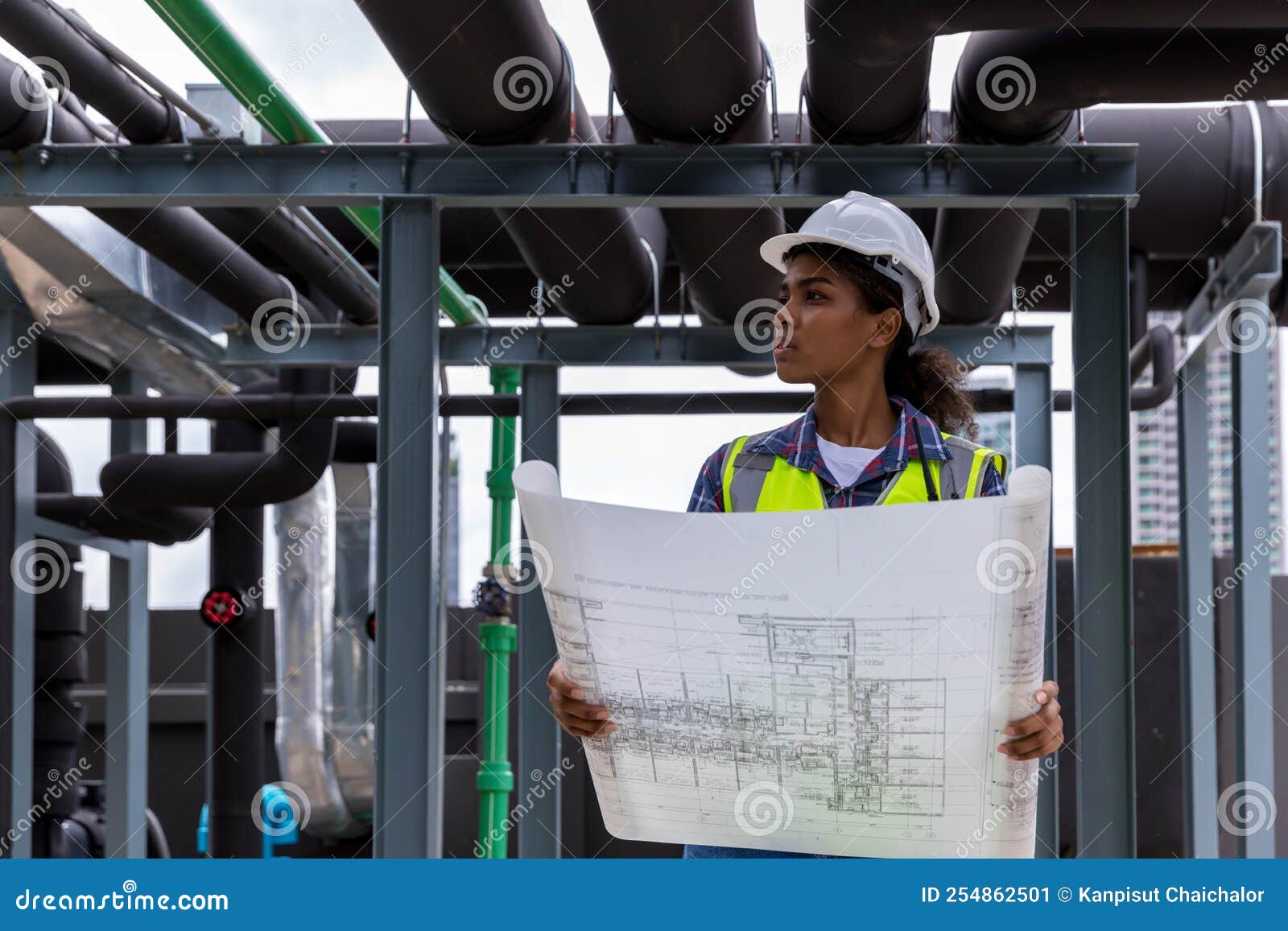 Engineers with Draft Plan of Building on Constructing Site. Engineer ...