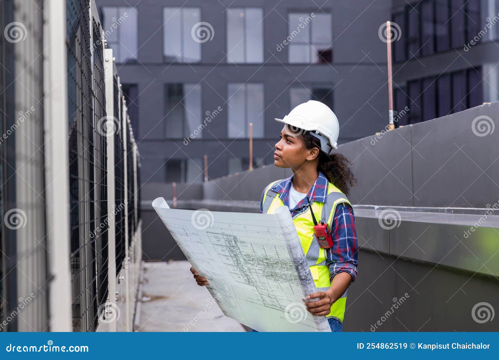 Engineers with Draft Plan of Building on Constructing Site. Engineer ...