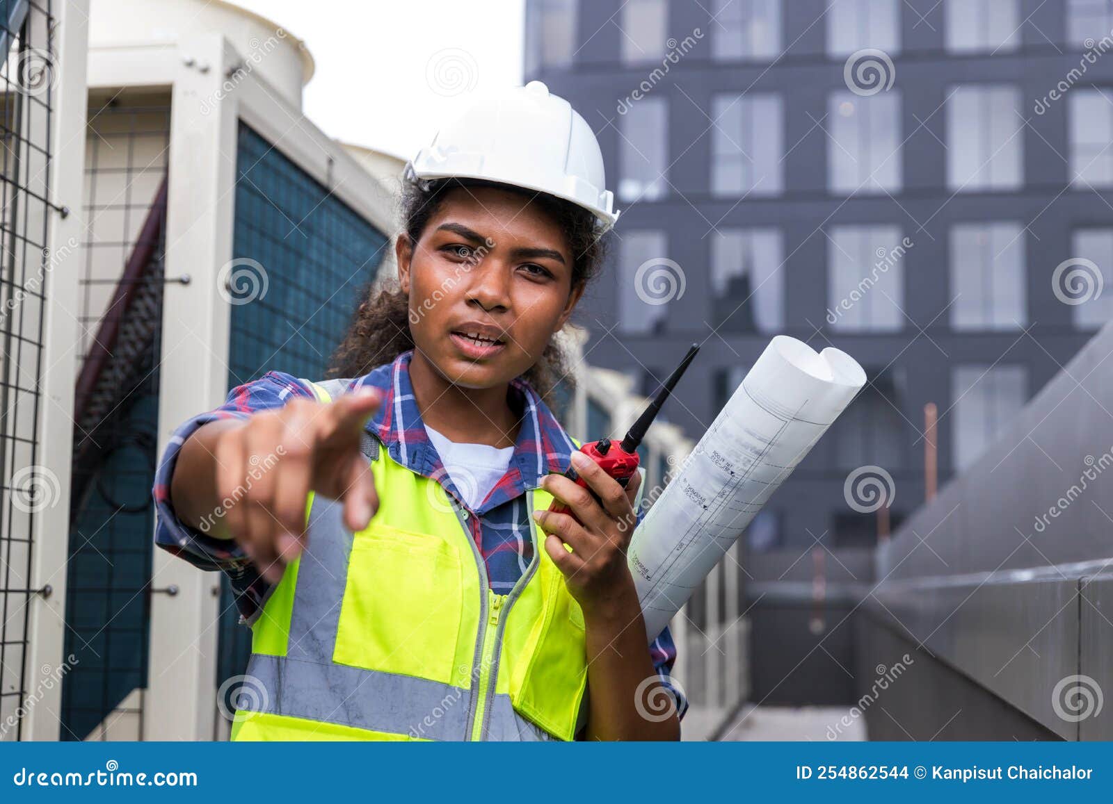 Engineers with Draft Plan of Building on Constructing Site. Engineer ...