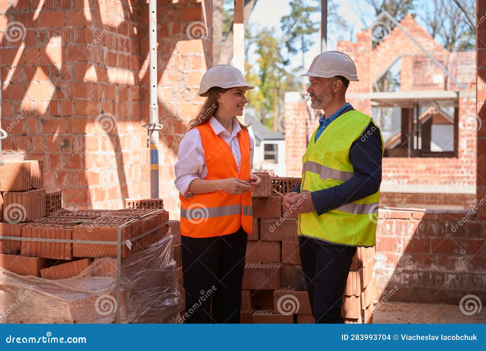 Engineers in Hardhats Counting Received Bricks and Discussing Building ...