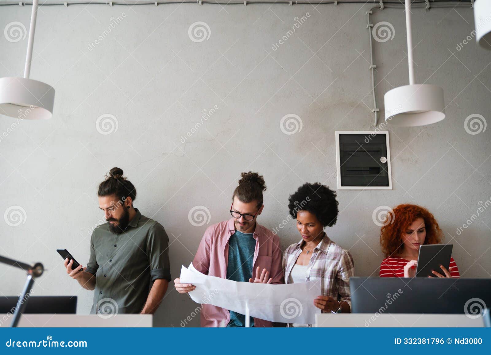 Engineers Helping Design Work on Blueprints, Collaborate on Structural ...