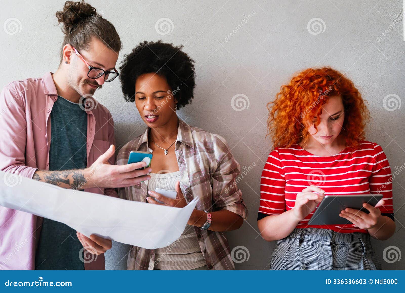 Engineers Helping Design Work on Blueprints, Collaborate on Structural ...