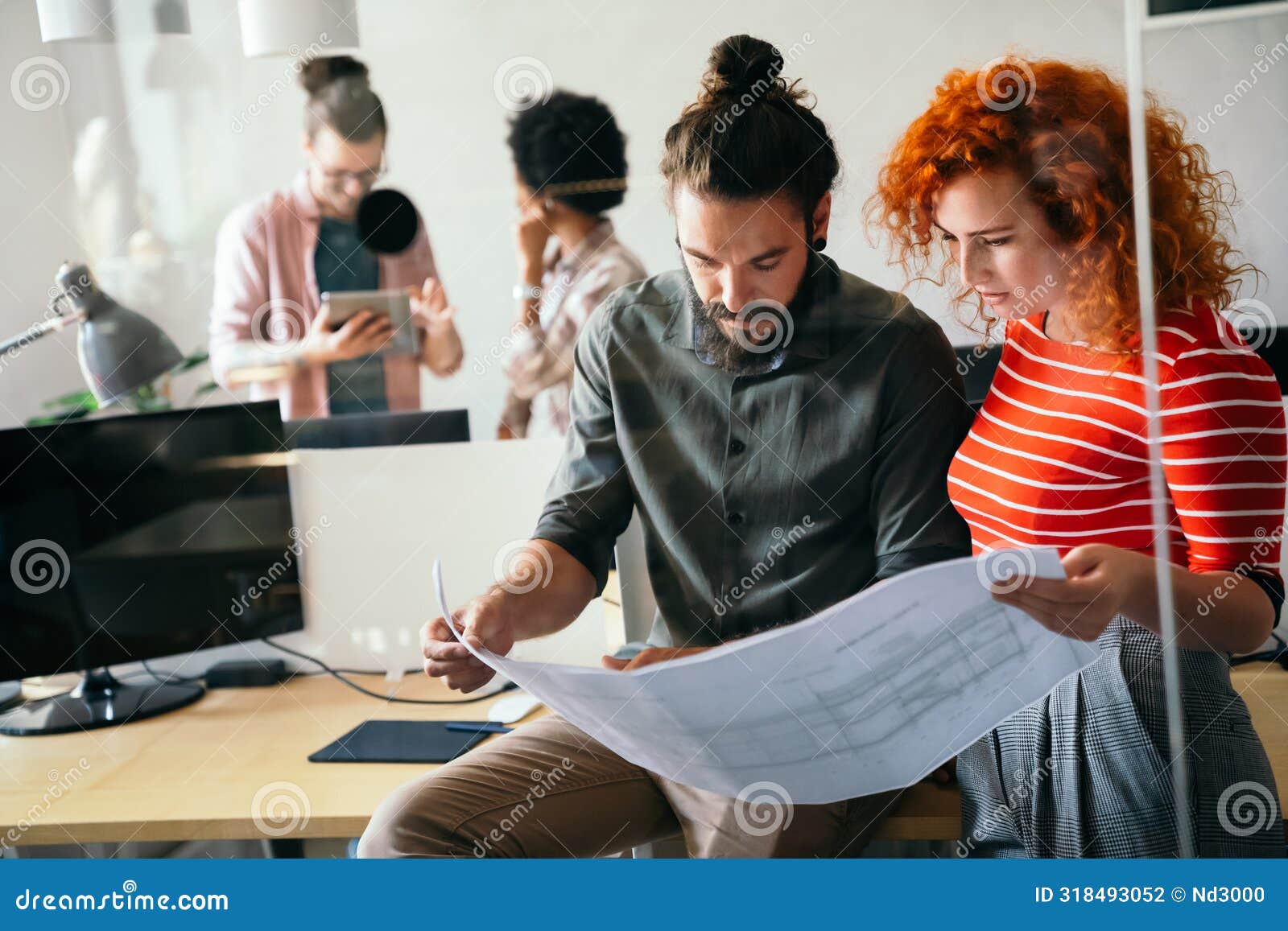 Engineers Helping Design Work on Blueprints, Collaborate on Structural ...