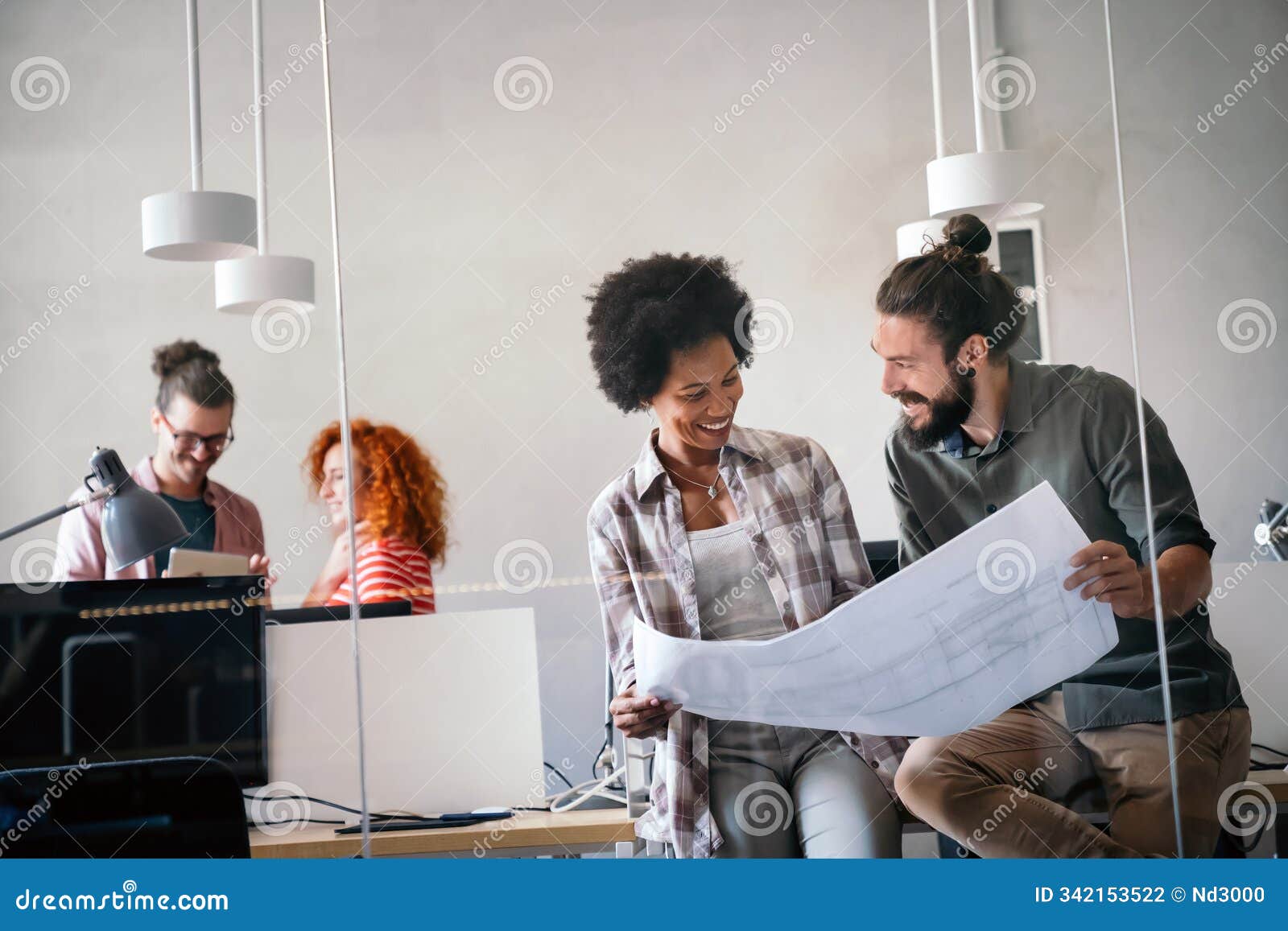 Engineers Helping Design Work on Blueprints, Collaborate on Structural ...