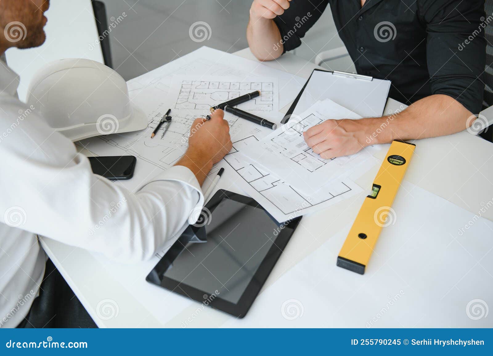 Engineers are Helping To Design Work on Blueprints and Collaborate on ...