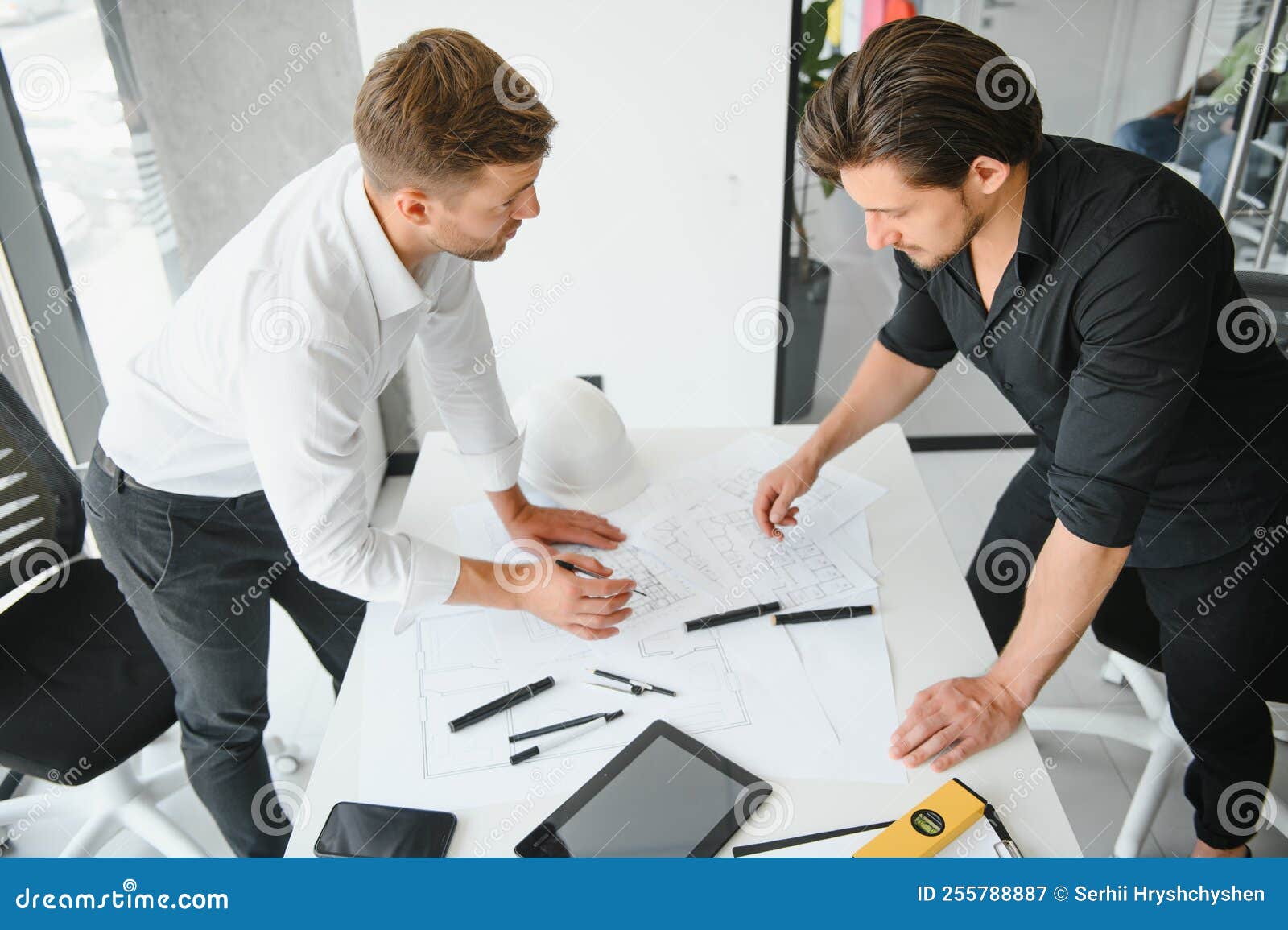 Engineers are Helping To Design Work on Blueprints and Collaborate on ...