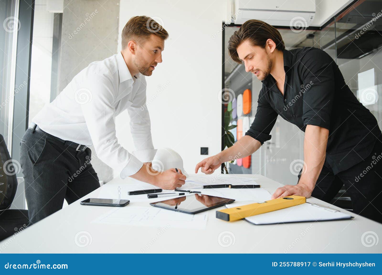 Engineers are Helping To Design Work on Blueprints and Collaborate on ...