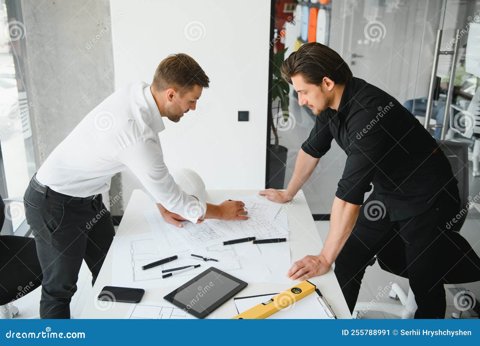 Engineers are Helping To Design Work on Blueprints and Collaborate on ...