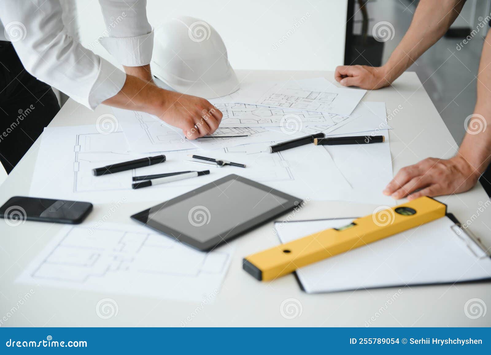 Engineers are Helping To Design Work on Blueprints and Collaborate on ...