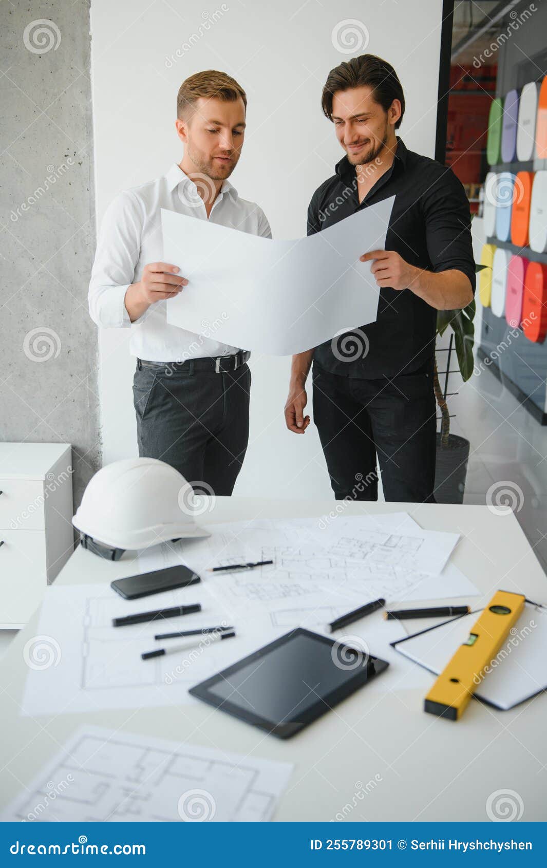 Engineers are Helping To Design Work on Blueprints and Collaborate on ...