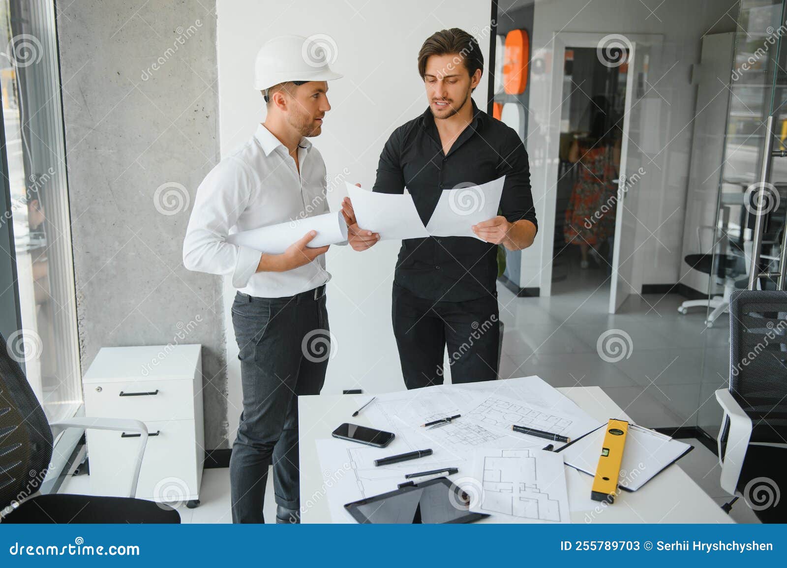 Engineers are Helping To Design Work on Blueprints and Collaborate on ...