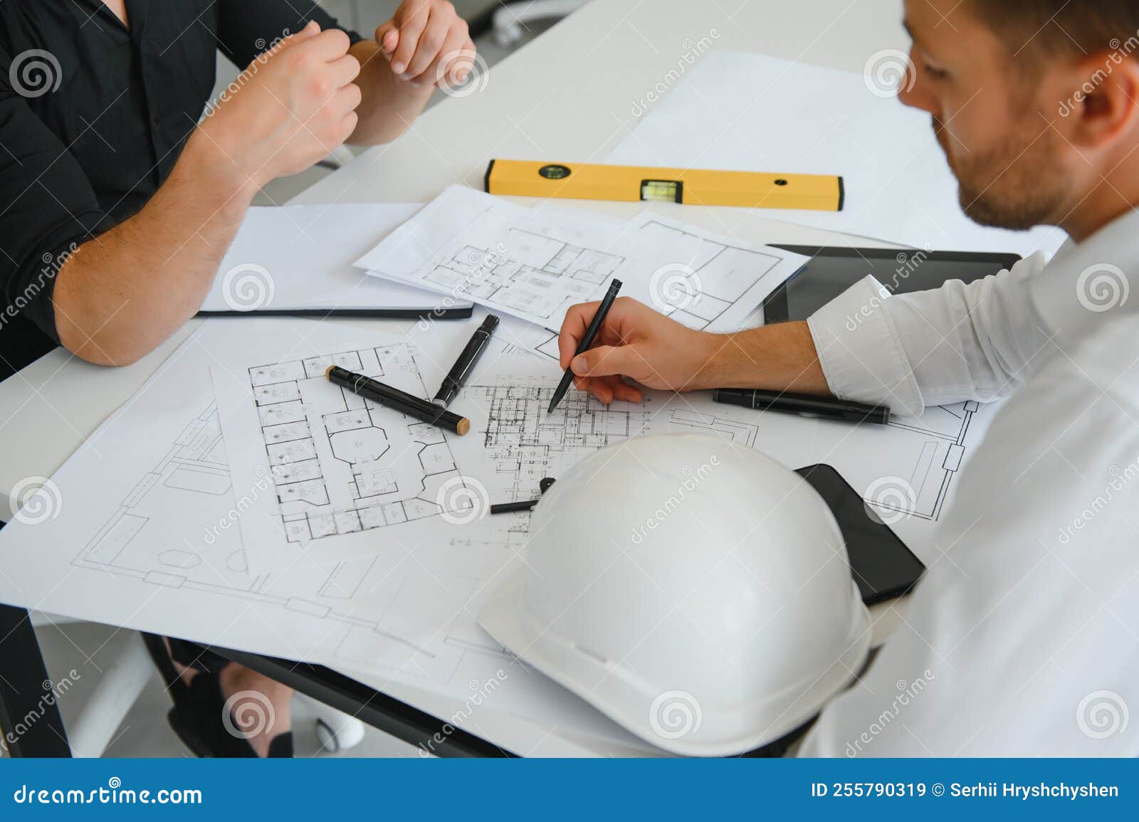 Engineers are Helping To Design Work on Blueprints and Collaborate on ...