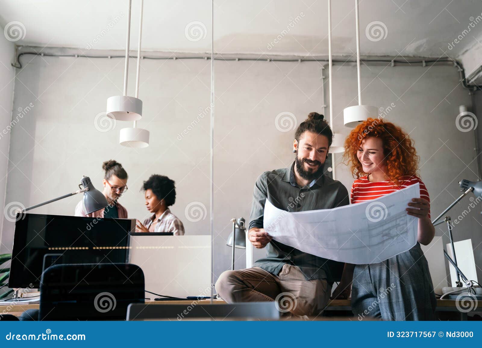 Engineers Helping Design Work on Blueprints, Collaborate on Structural ...